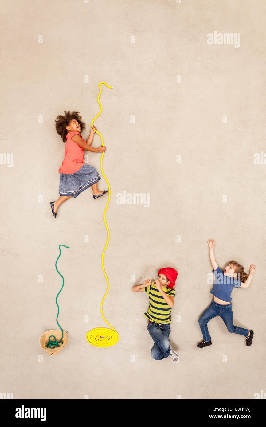 Children playing snake charmers Stock Photo - Alamy