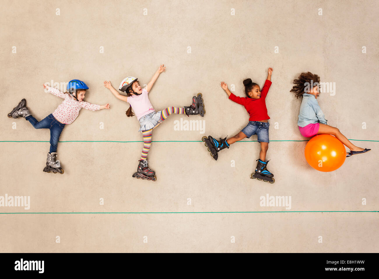 Inline skating children having fun Stock Photo - Alamy