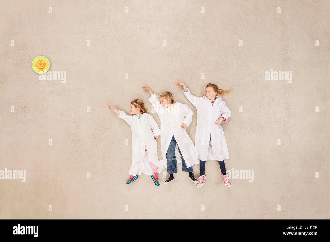 Children wearing laboratory coats doing experiments Stock Photo - Alamy