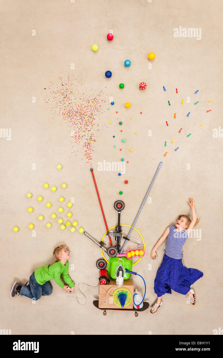 Children trying out new ball machine Stock Photo - Alamy