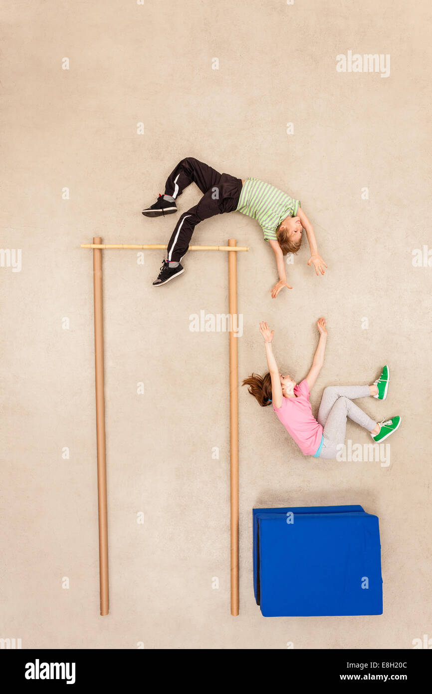Children training high jump Stock Photo - Alamy