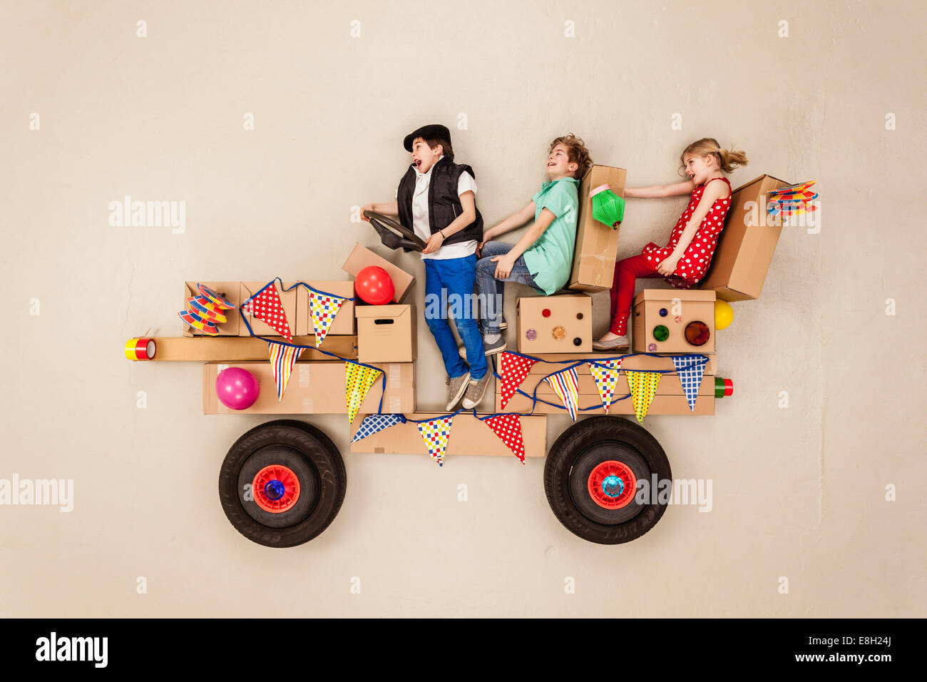 Kids driving to party, having fun Stock Photo - Alamy