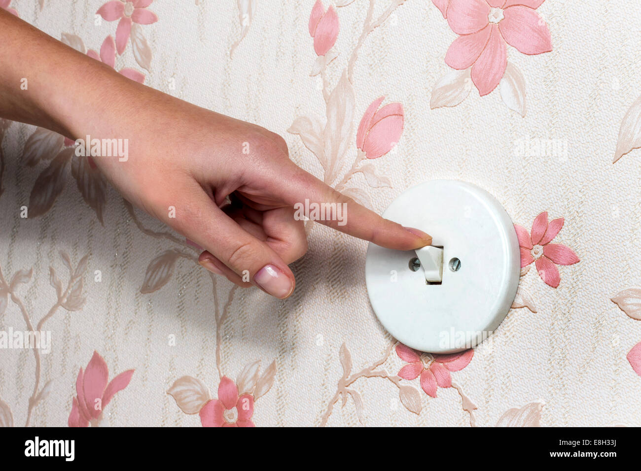 Woman switching on light hi-res stock photography and images - Alamy