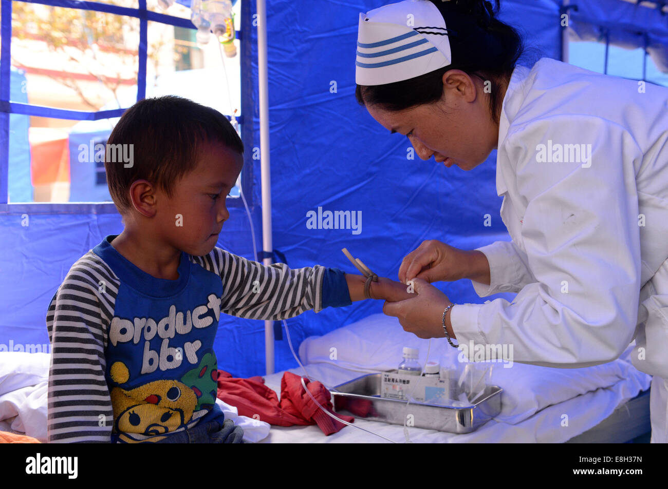 Jinggu, China's Yunnan Province. 8th Oct, 2014. A kid takes an ...