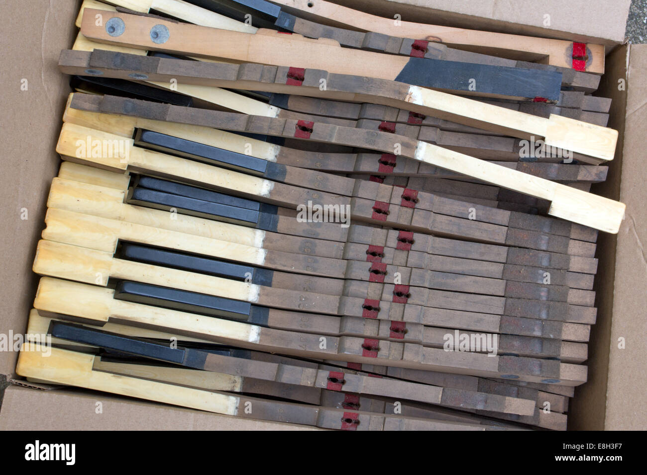 Cardboard box containing old piano keys Stock Photo - Alamy