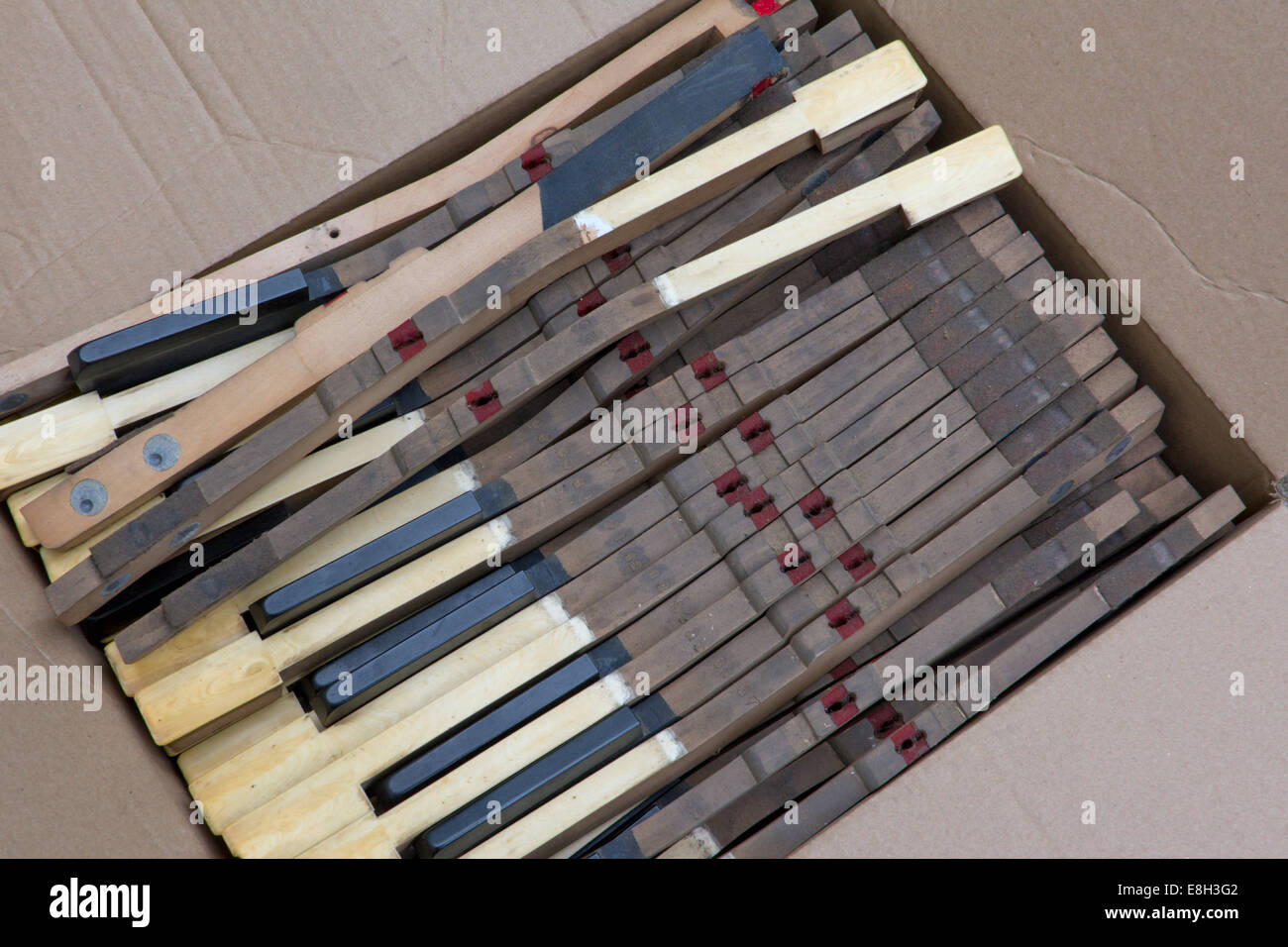 Cardboard box containing old piano keys Stock Photo - Alamy