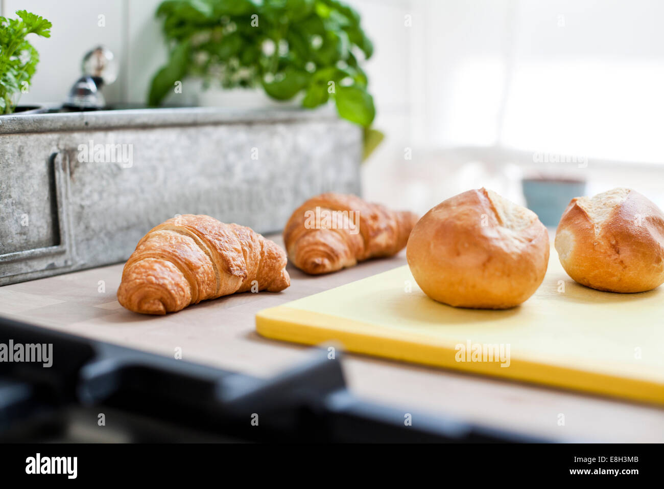 Two croissants and two bread rolls Stock Photo - Alamy