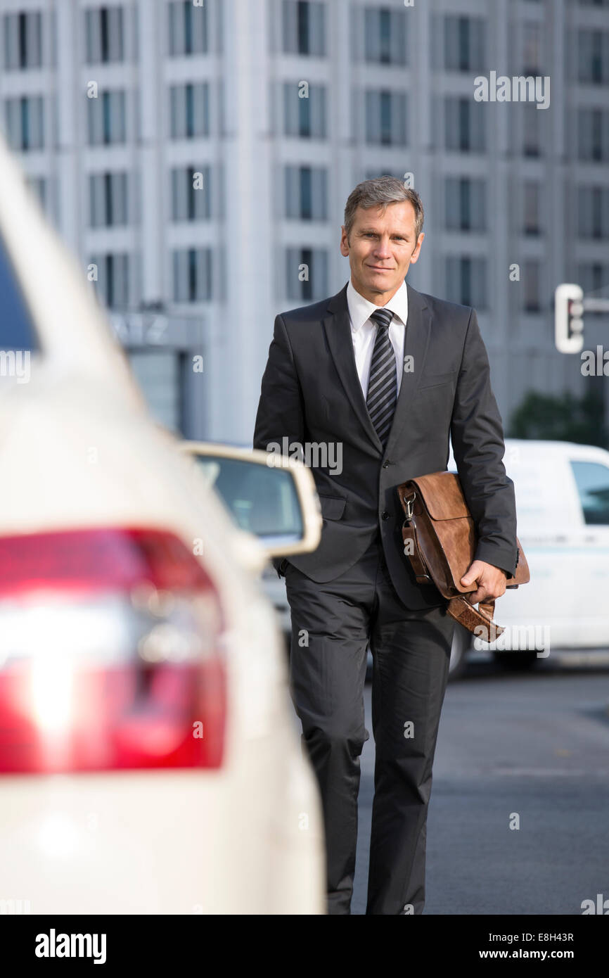 Germany, Berlin, Businessman taking a taxi Stock Photo - Alamy