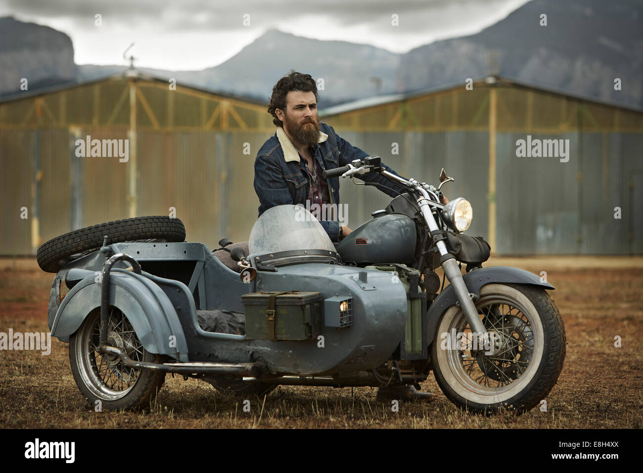 Man with full beard in motorcycle with sidecar Stock Photo - Alamy
