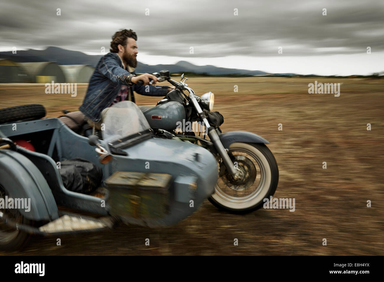 Man with full beard driving motorcycle with sidecar Stock Photo - Alamy