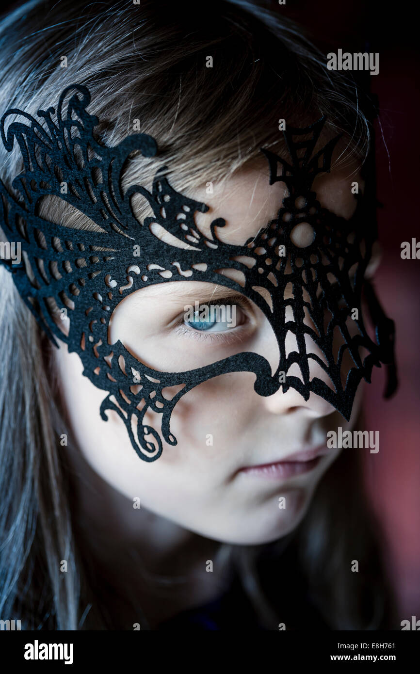 Portrait of girl wearing black Halloween mask Stock Photo - Alamy