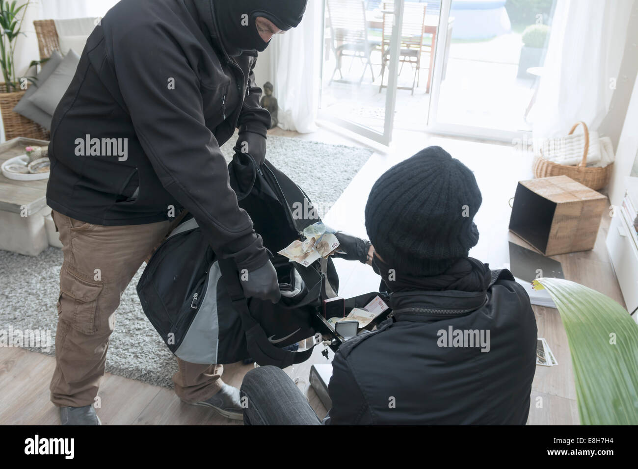 Two burglars at work in an one-family house at daytime Stock Photo - Alamy