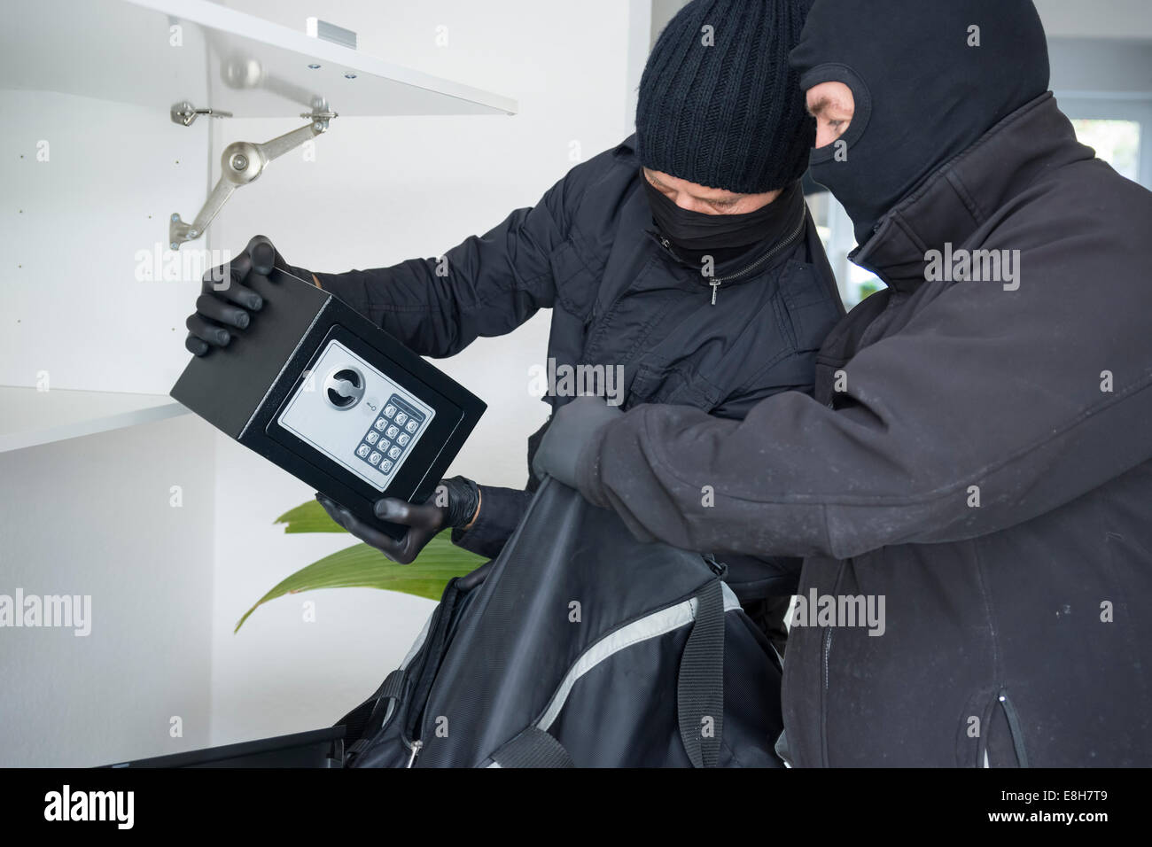 Two burglars at work in an one-family house at daytime Stock Photo - Alamy