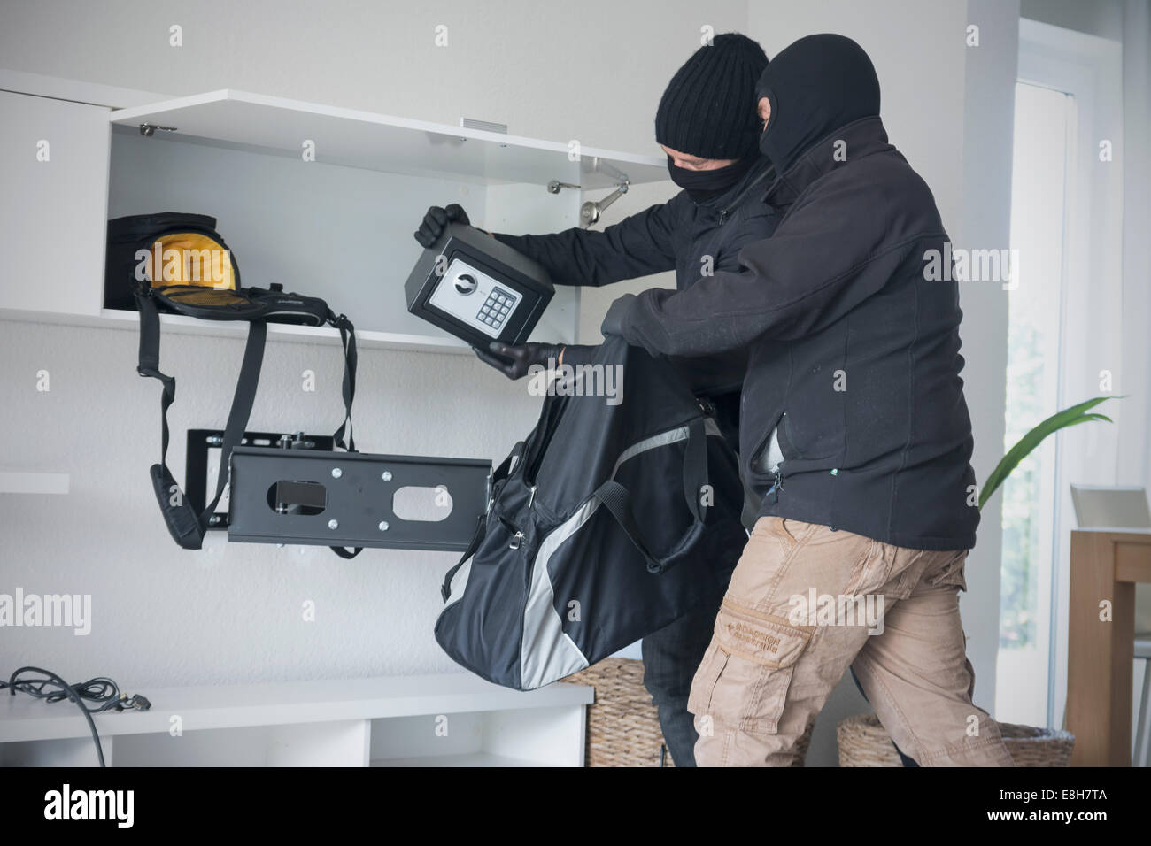 Two burglars at work in an one-family house at daytime Stock Photo - Alamy