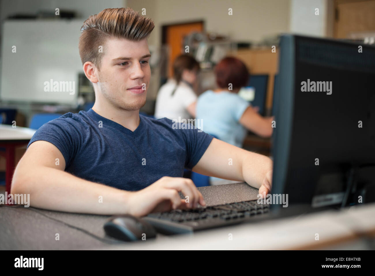 Vocational school student in computer lab Stock Photo - Alamy