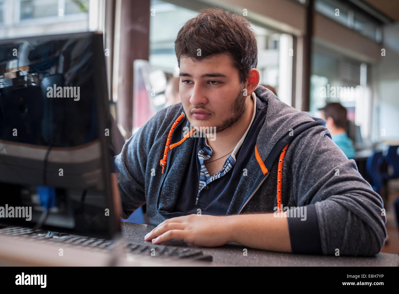 Vocational school student in computer lab Stock Photo - Alamy