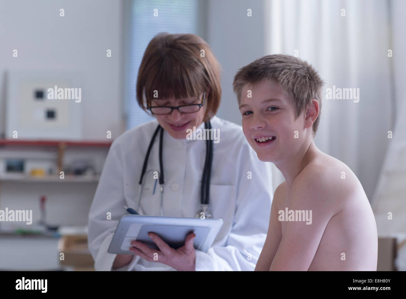 Smiling boy in medical practice Stock Photo - Alamy