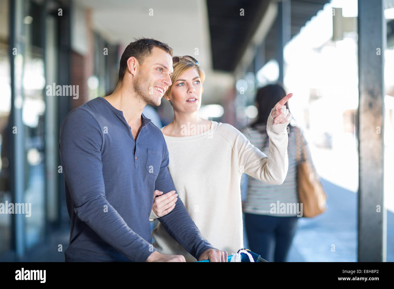 Couple watching something Stock Photo - Alamy