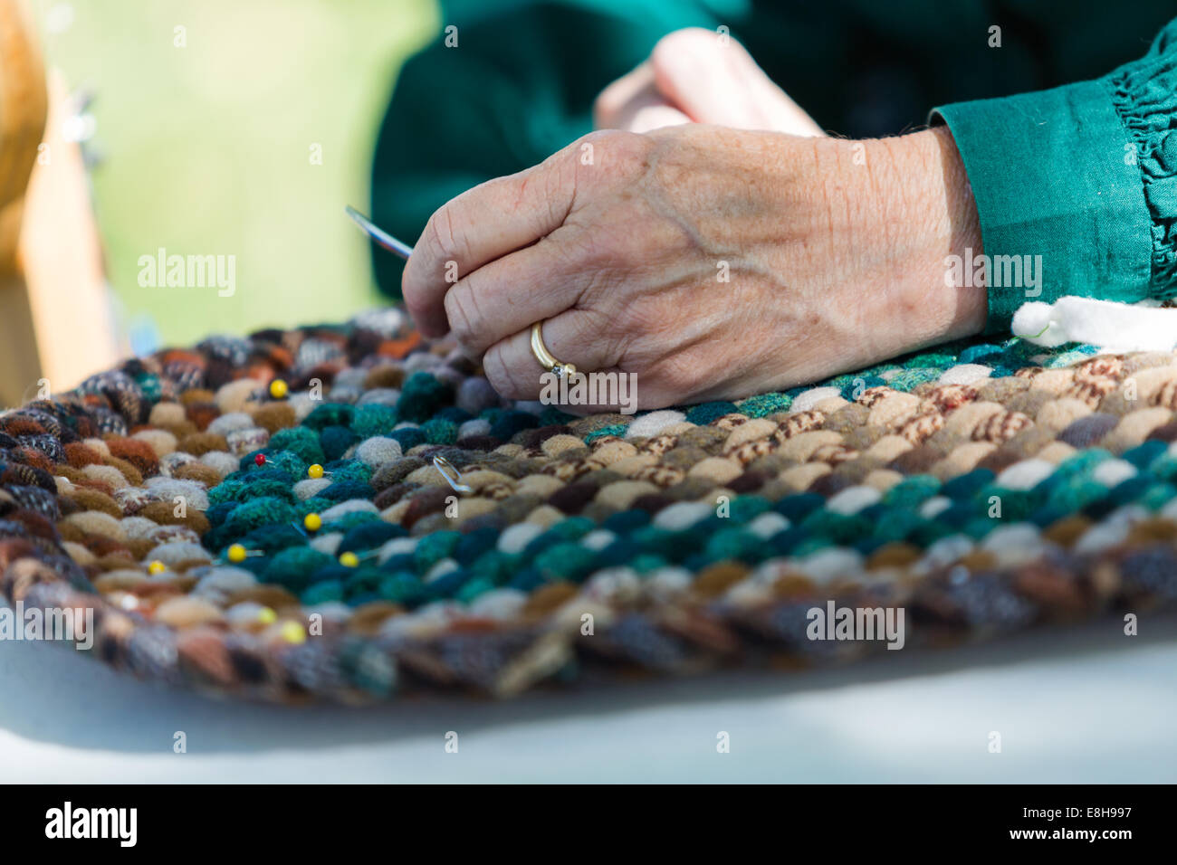 Making a rug with vintage materials by old woman Stock Photo - Alamy