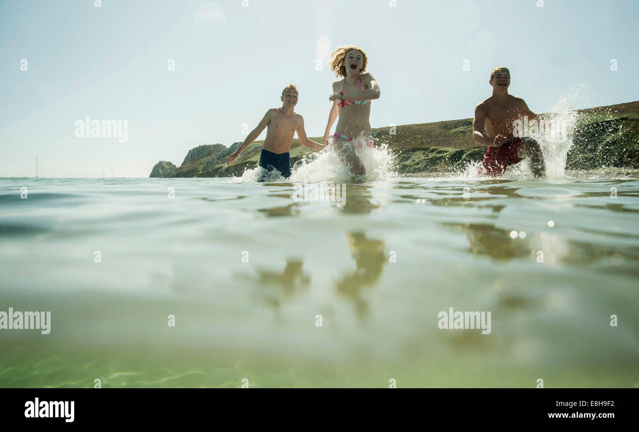 Three teenagers enjoying beachlife Stock Photo - Alamy