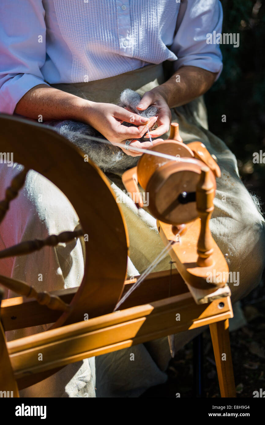 Wool spinning with vintage tools on old estate Stock Photo - Alamy
