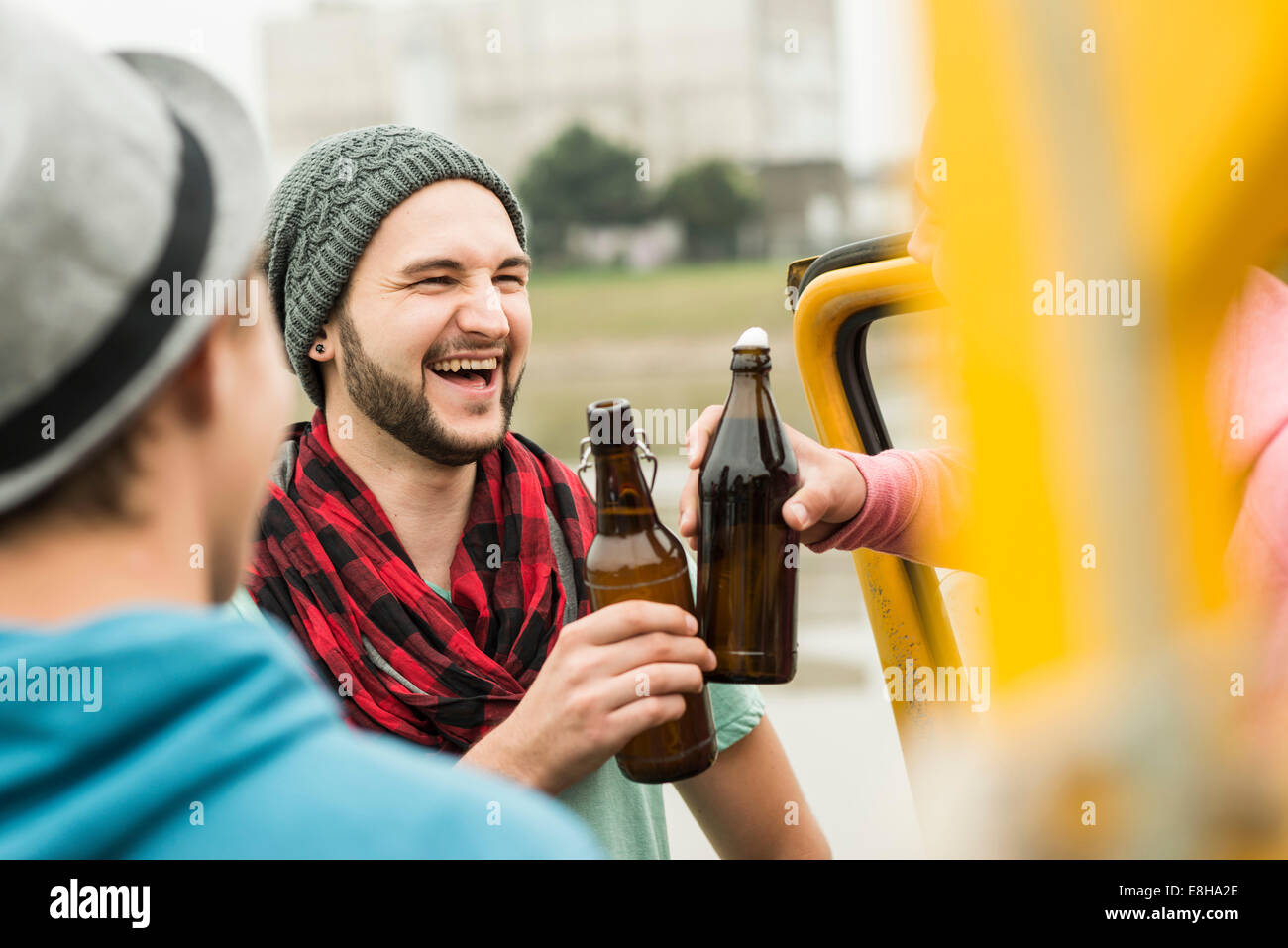 Group of friends drinking beer outdoors Stock Photo - Alamy