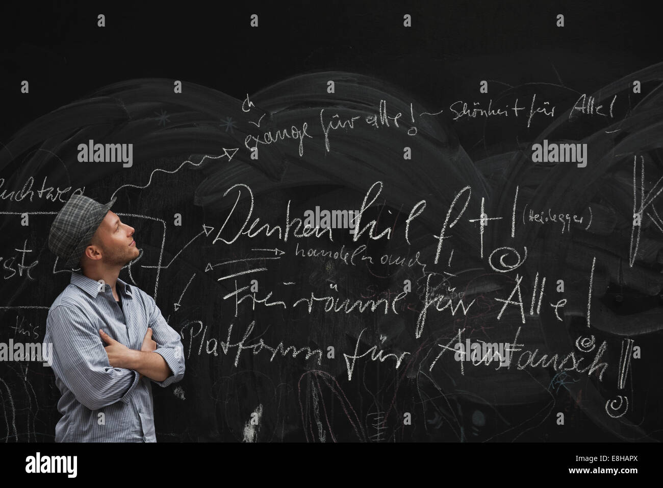 Man reading text on blackboard hi-res stock photography and images - Alamy