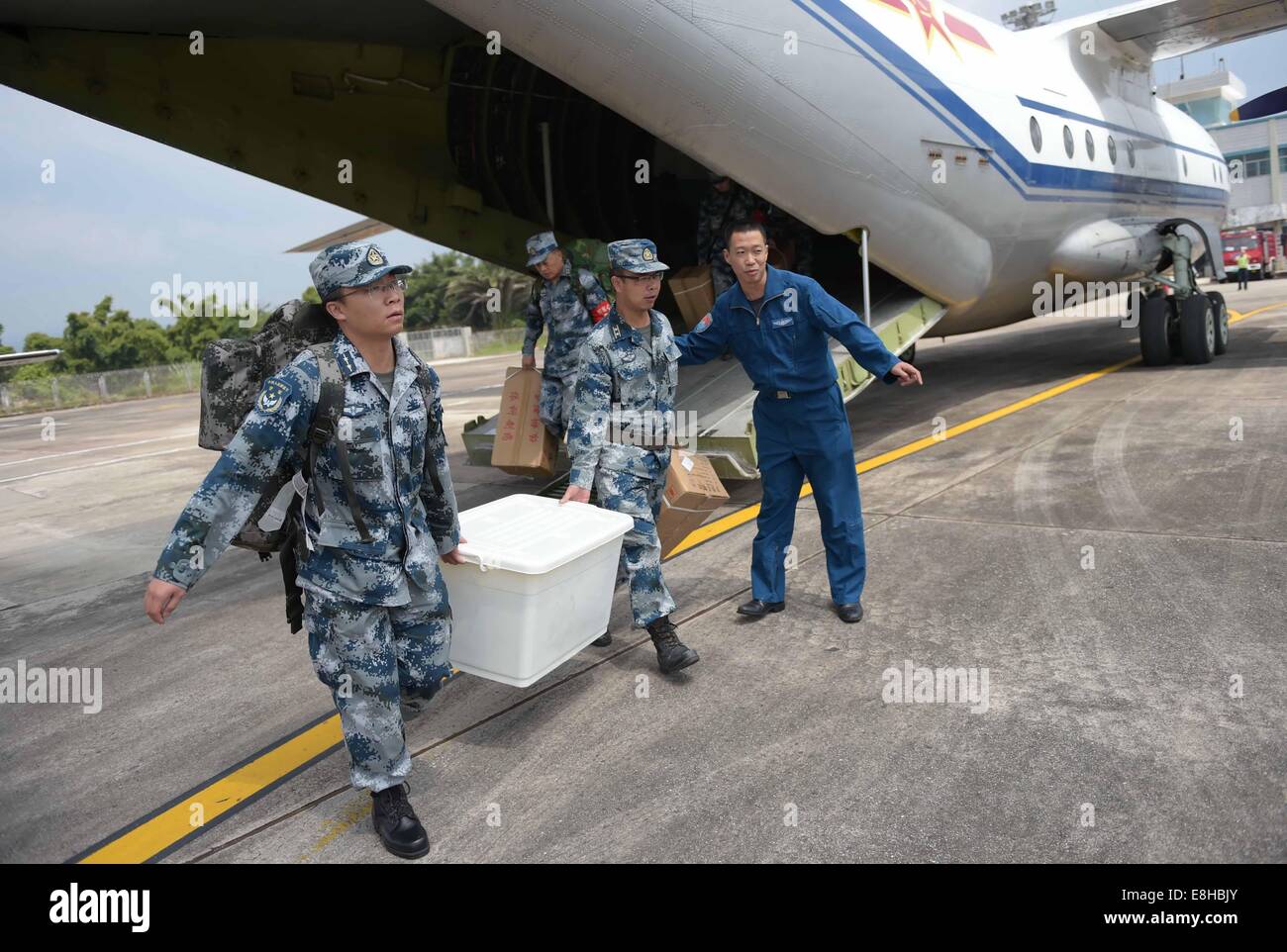 Yunnan, China. 8th October, 2014. Soldiers carry medical supplies for ...