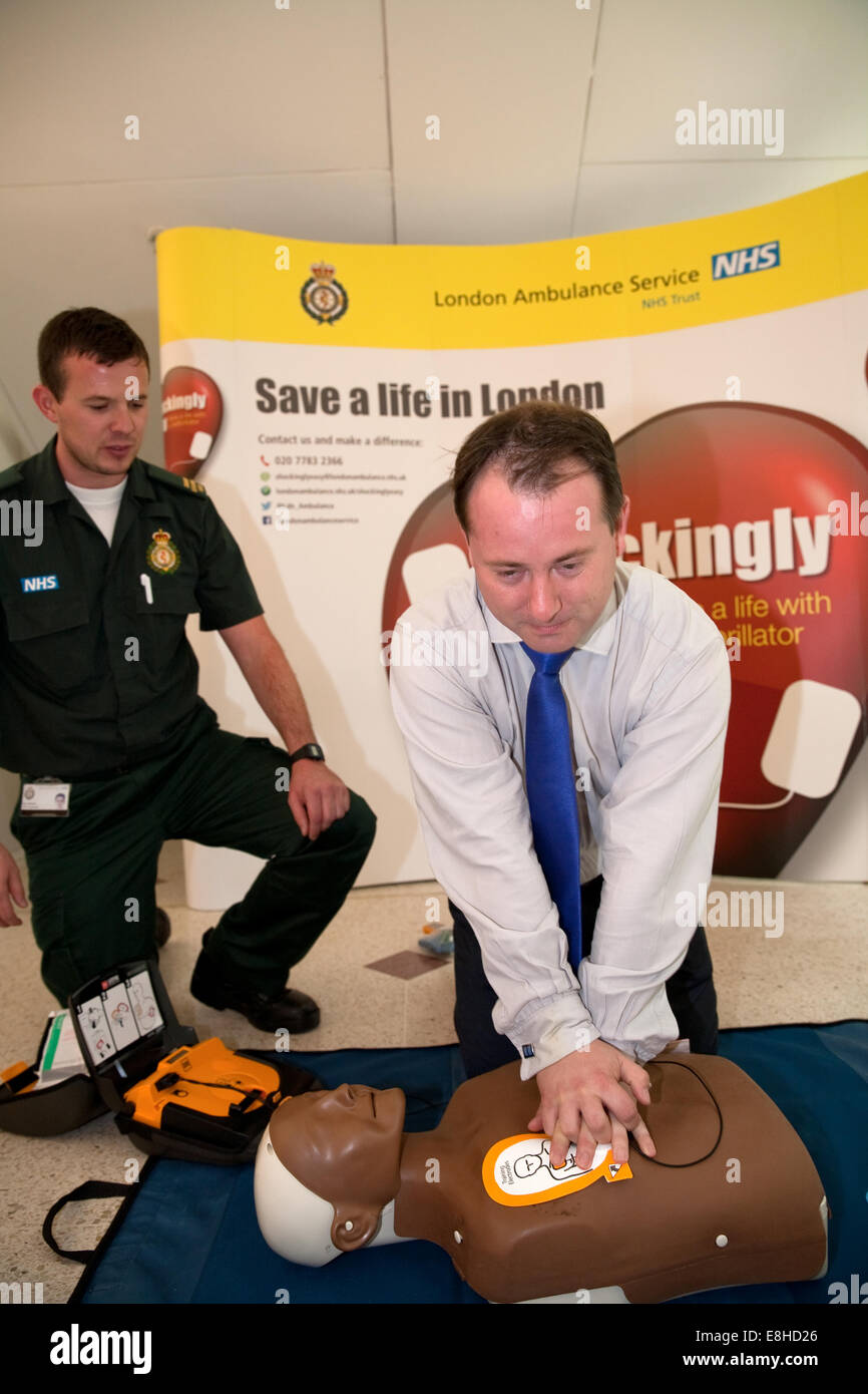 Councillor Peter Fortune is shown by a LAS member of staff how to use a ...