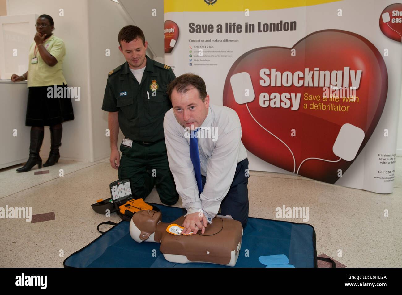 Councillor Peter Fortune is shown by a LAS member of staff how to do ...