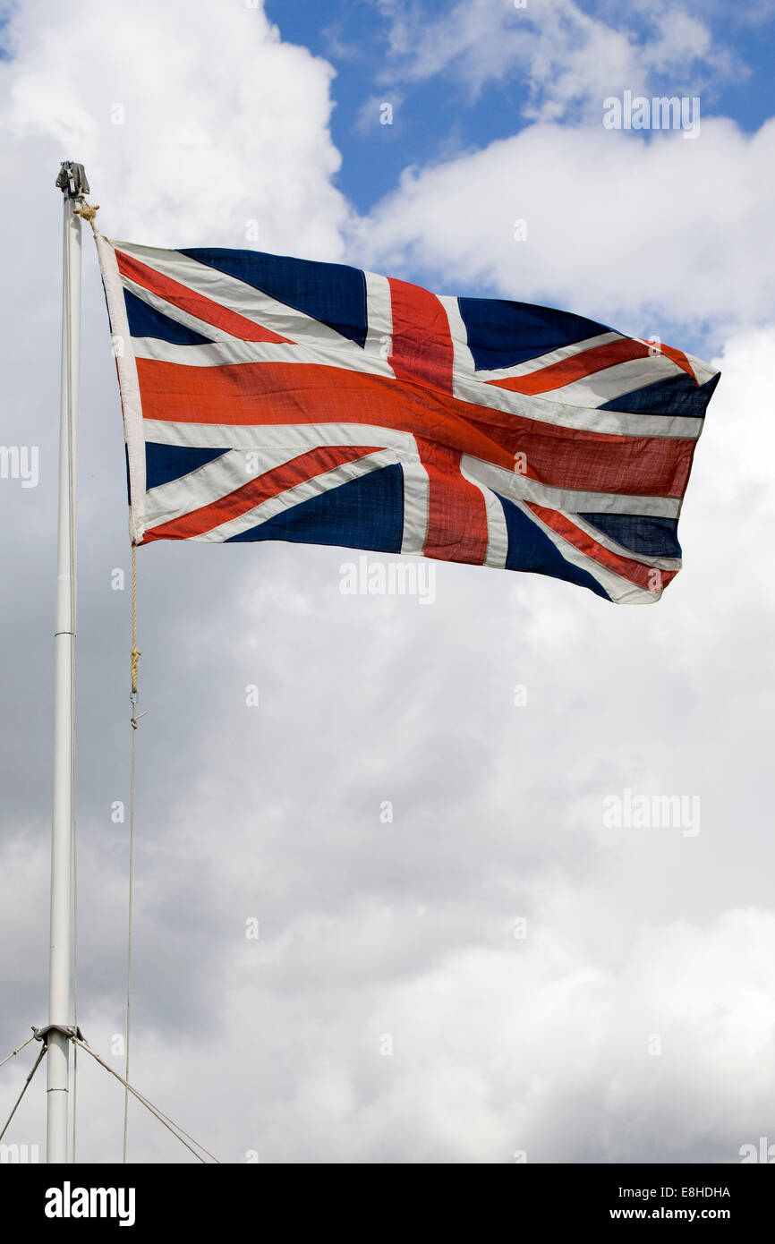 The Union Jack Flying against a blue sky Stock Photo - Alamy