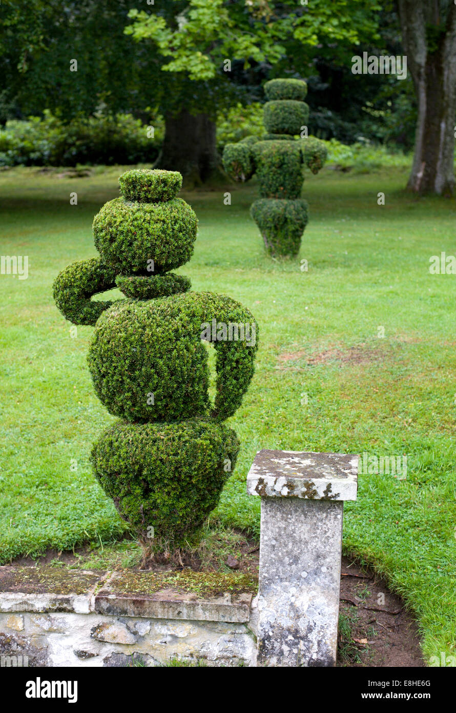comical piece of topiary in the vague form of a person dancing or ...