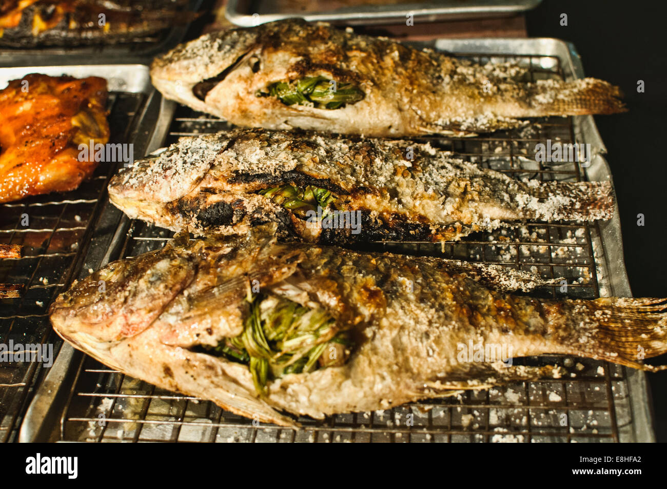 Grilled fish - street food in Bangkok, Thailand Stock Photo - Alamy