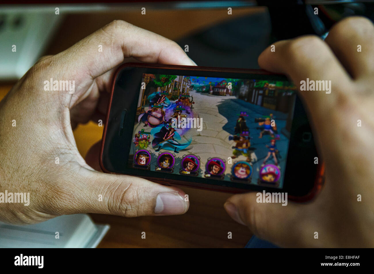 Playing on mobile phone Stock Photo - Alamy