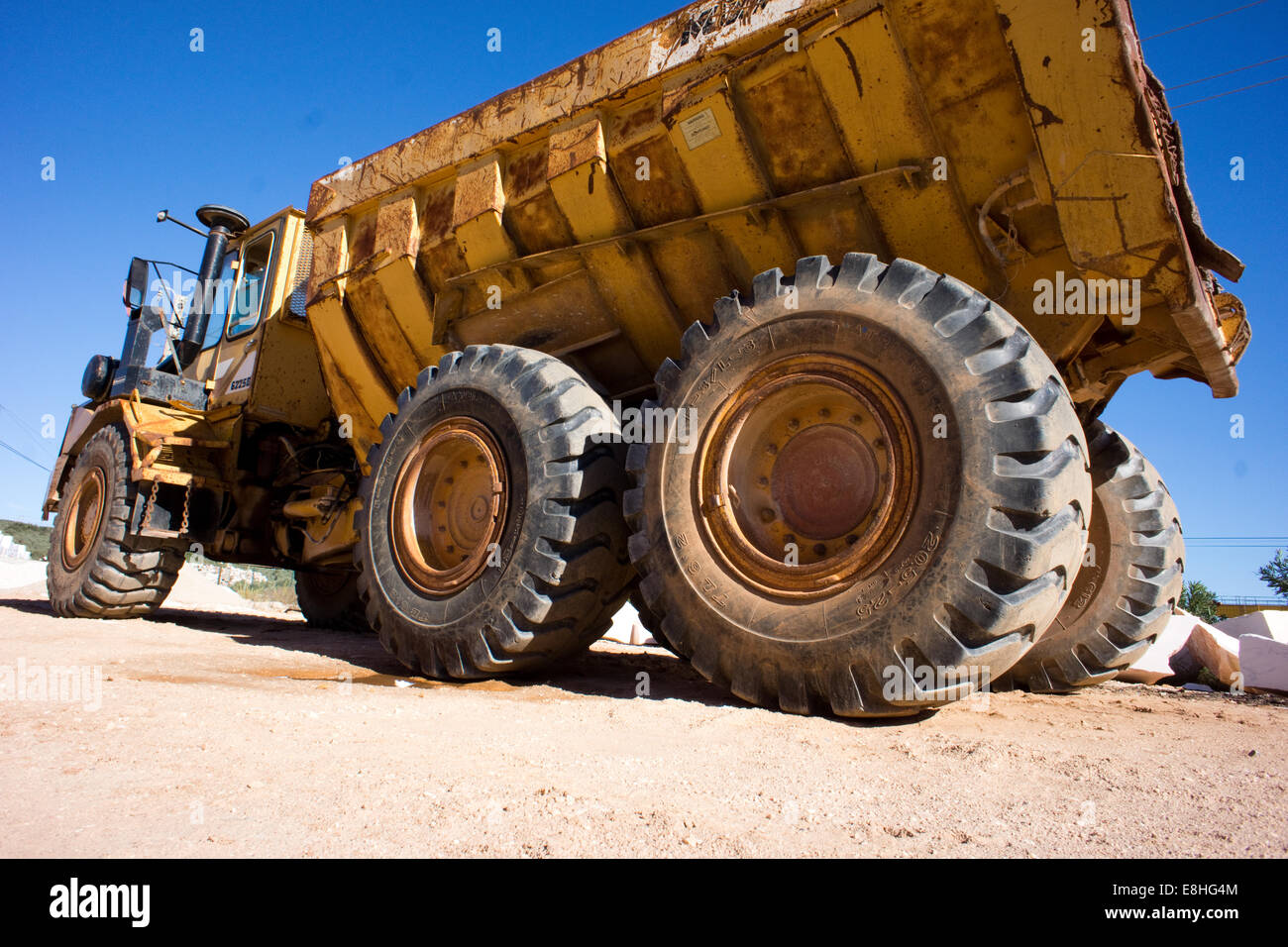 Big Yellow Truck in Portuguese Stone Quarry Stock Photo - Alamy