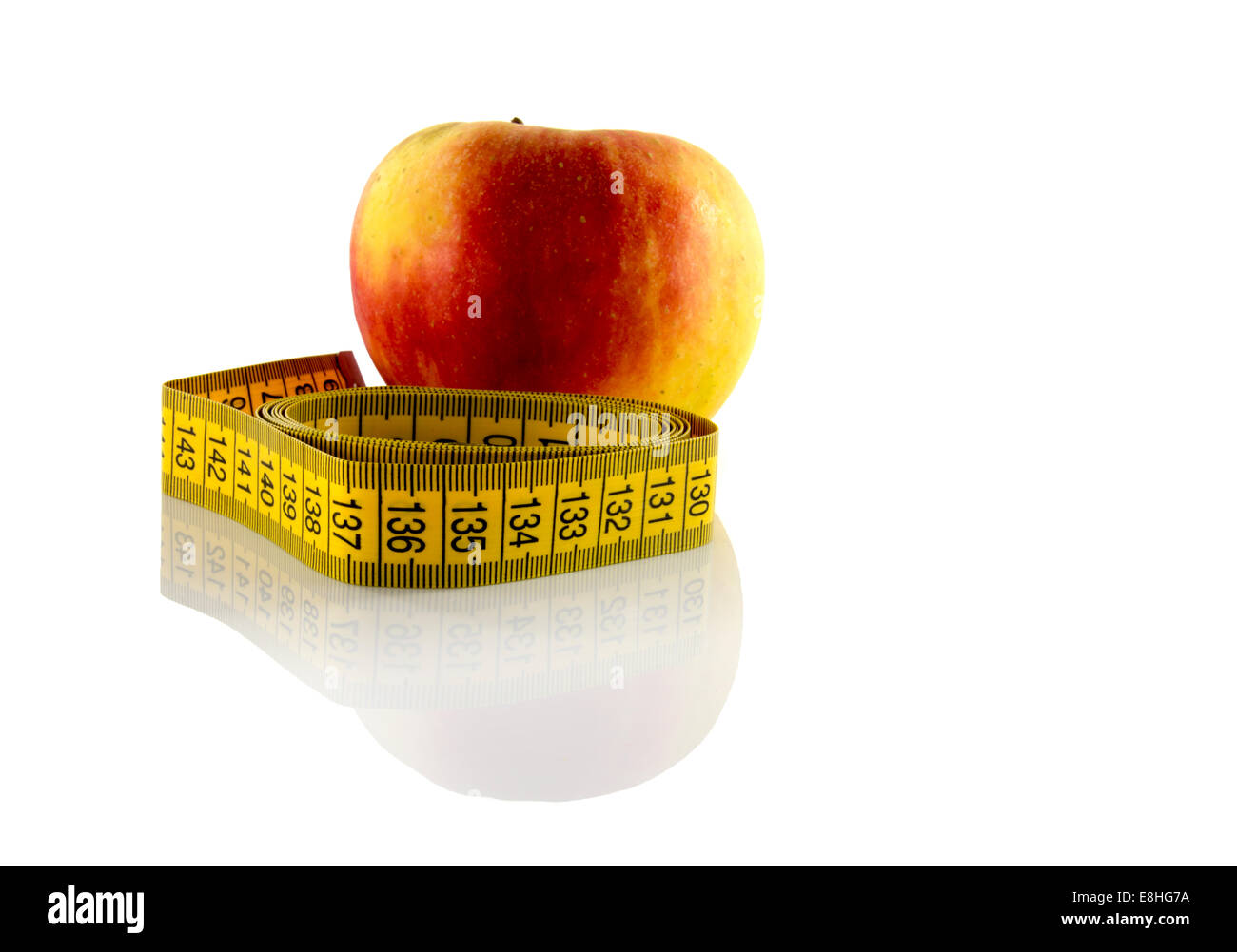apple measured the meter on a white background Stock Photo - Alamy