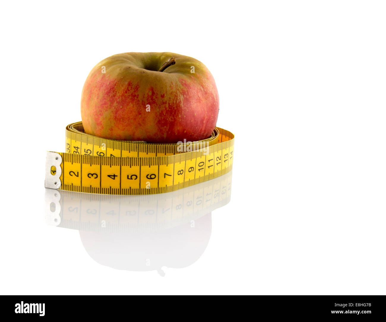 apple measured the meter on a white background Stock Photo - Alamy