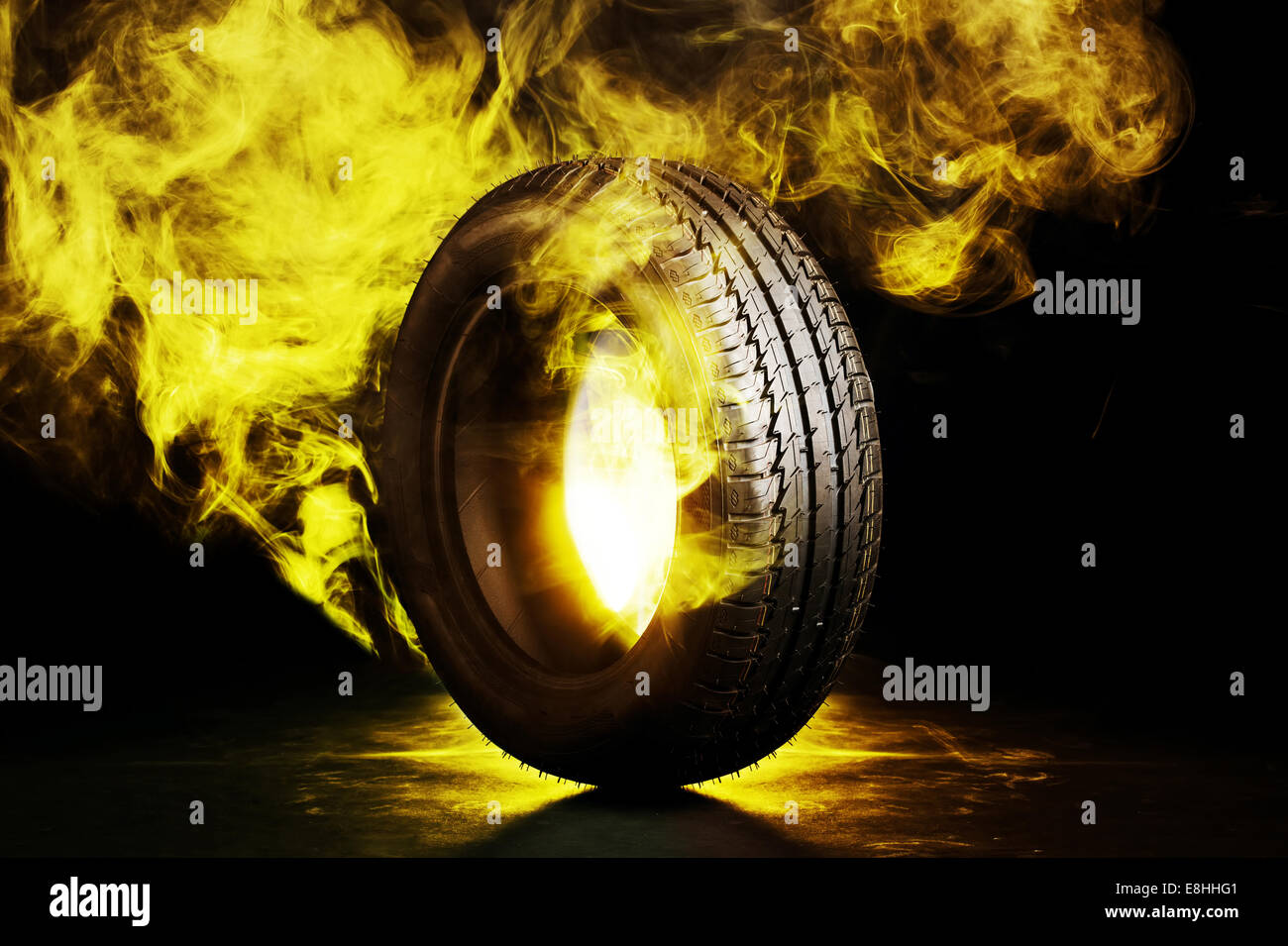 black smoked burning tire Stock Photo - Alamy