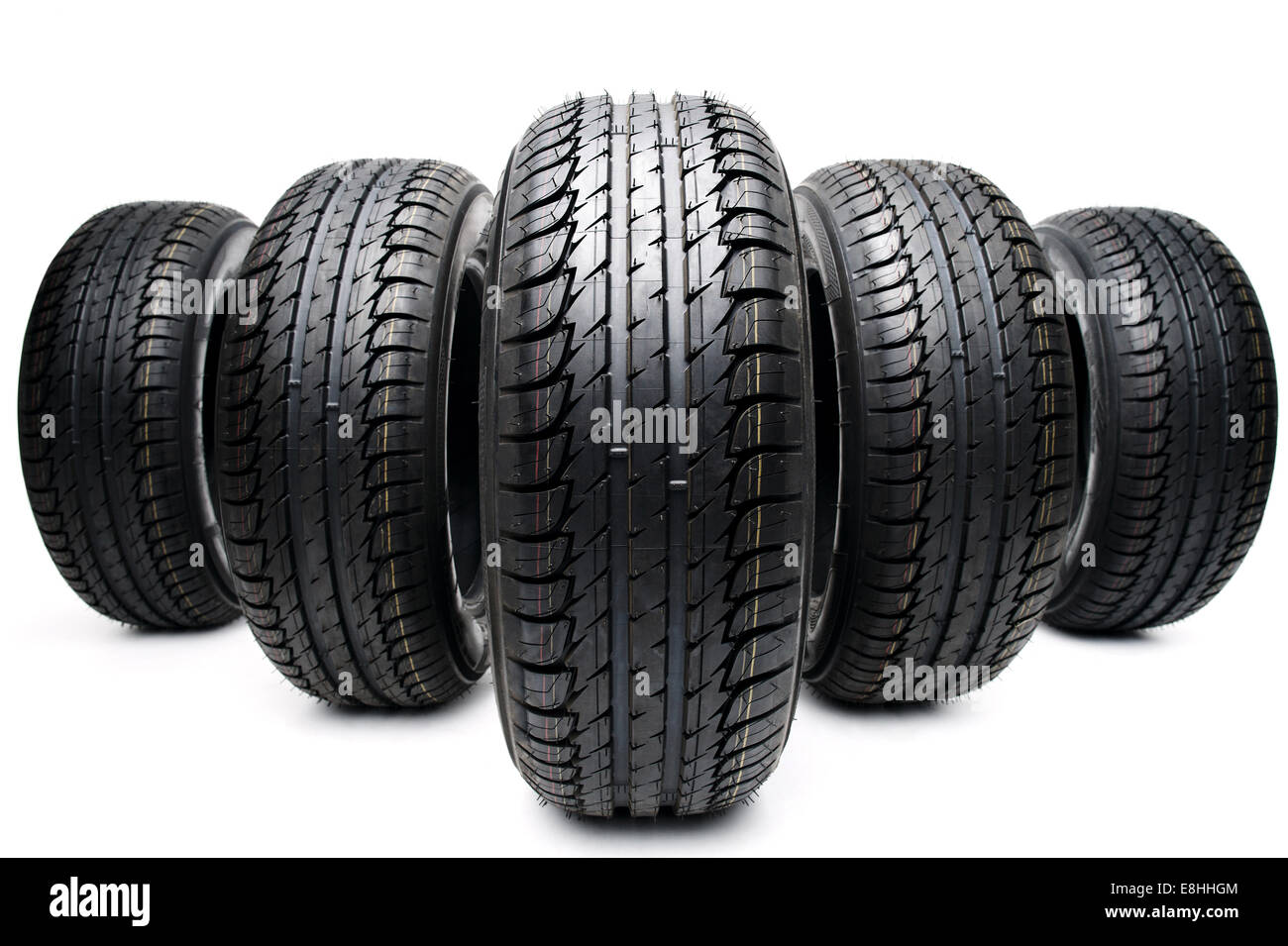 five tires formation isolated on white Stock Photo - Alamy