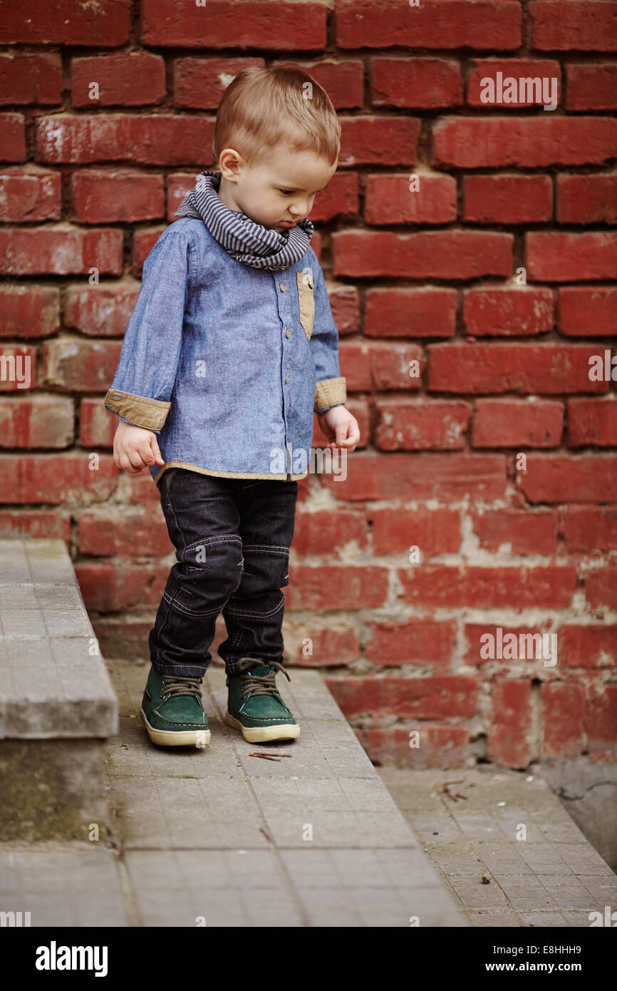 little boy walks alone on stairway Stock Photo - Alamy