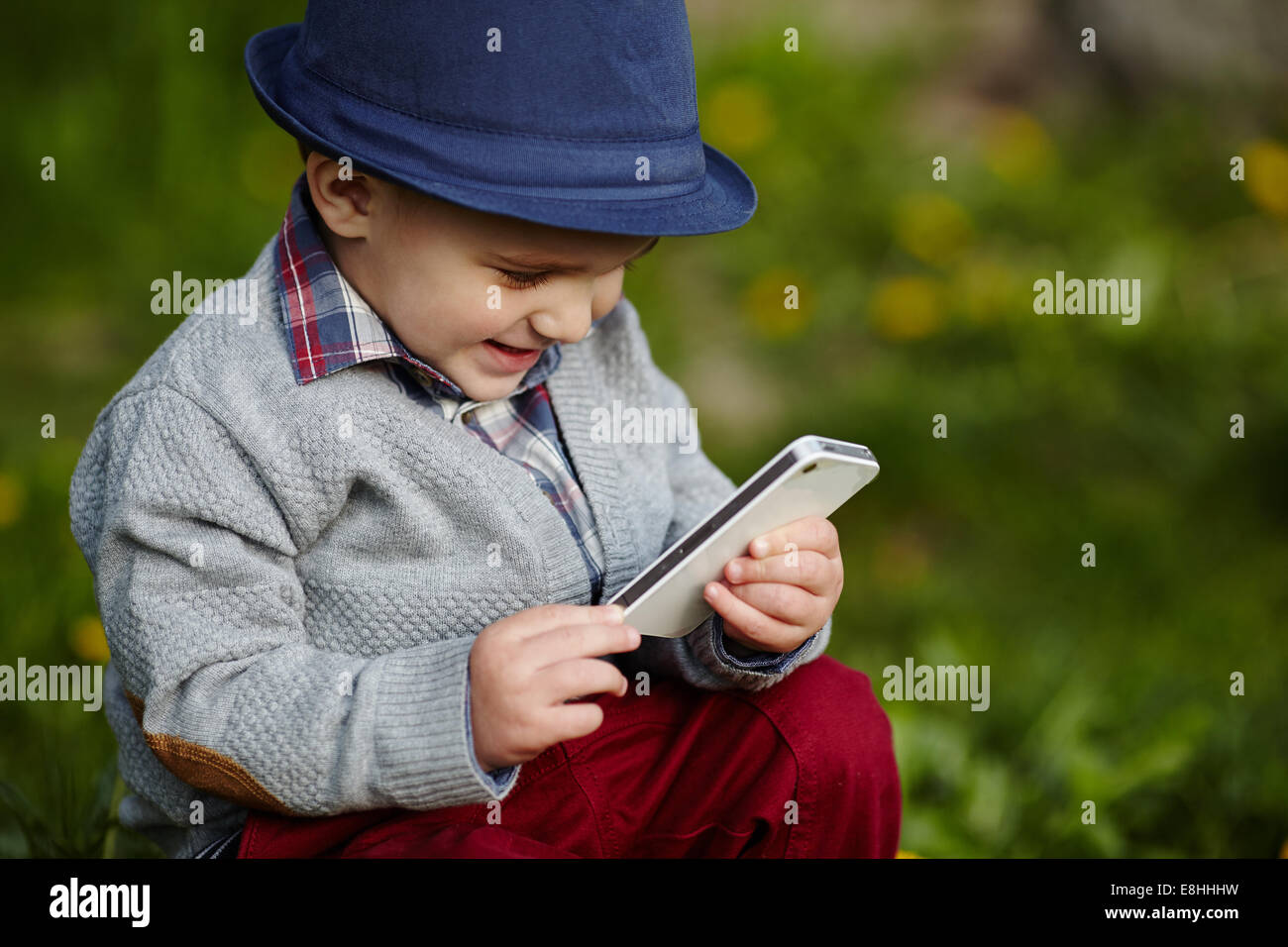 little modern boy with mobile phone Stock Photo - Alamy