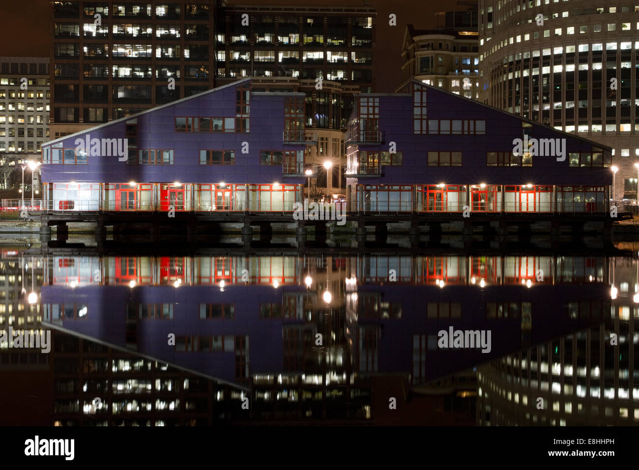 Reflections in water of the various buildings in London's Canary Wharf ...