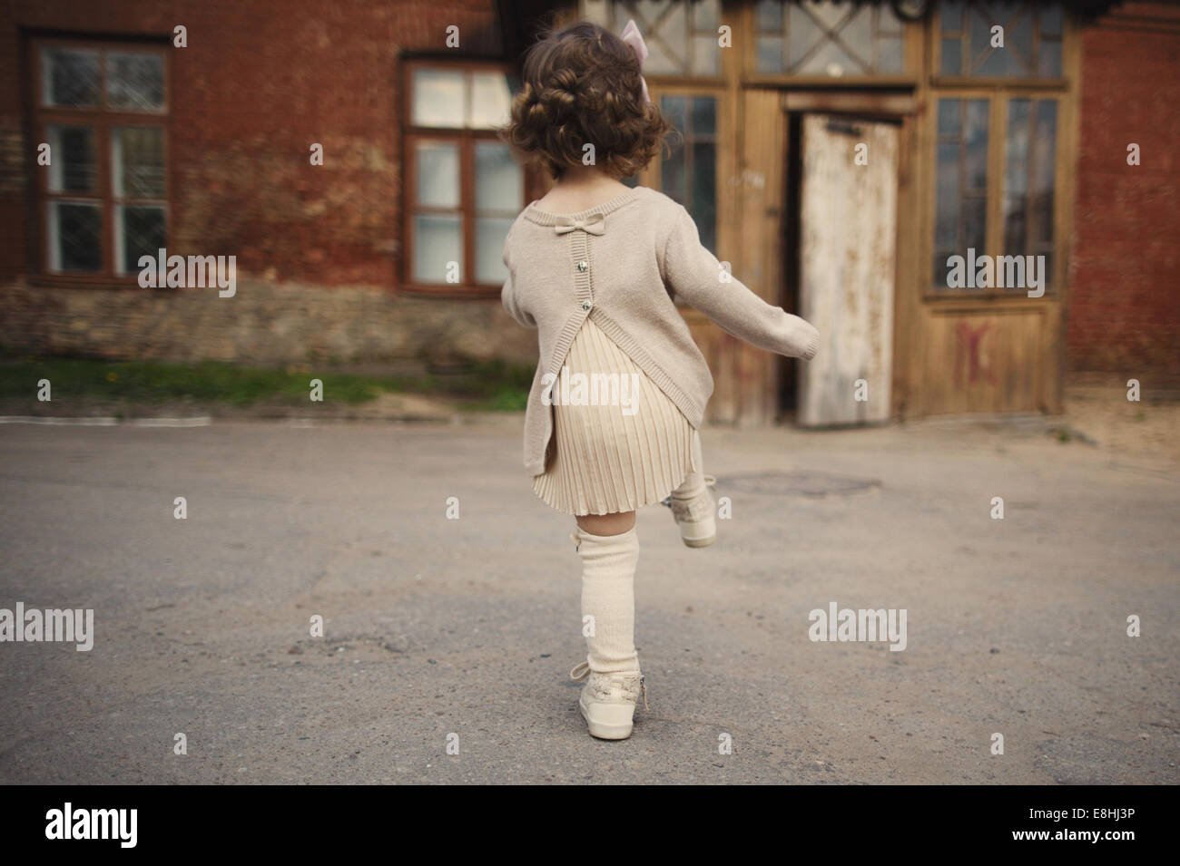 little girl walking away Stock Photo - Alamy