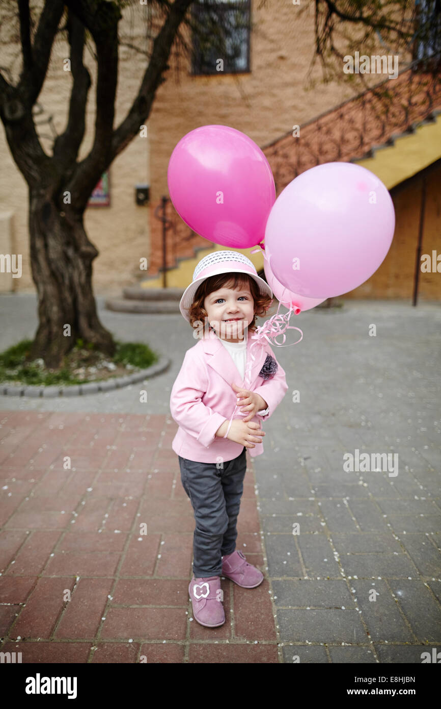 girl with pink balloons urban portrait Stock Photo - Alamy