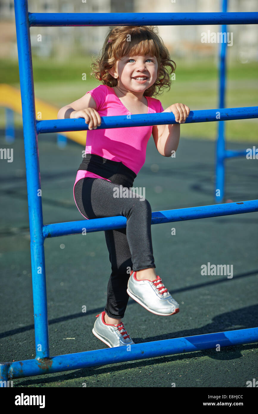 cute little girl plays on playground Stock Photo - Alamy