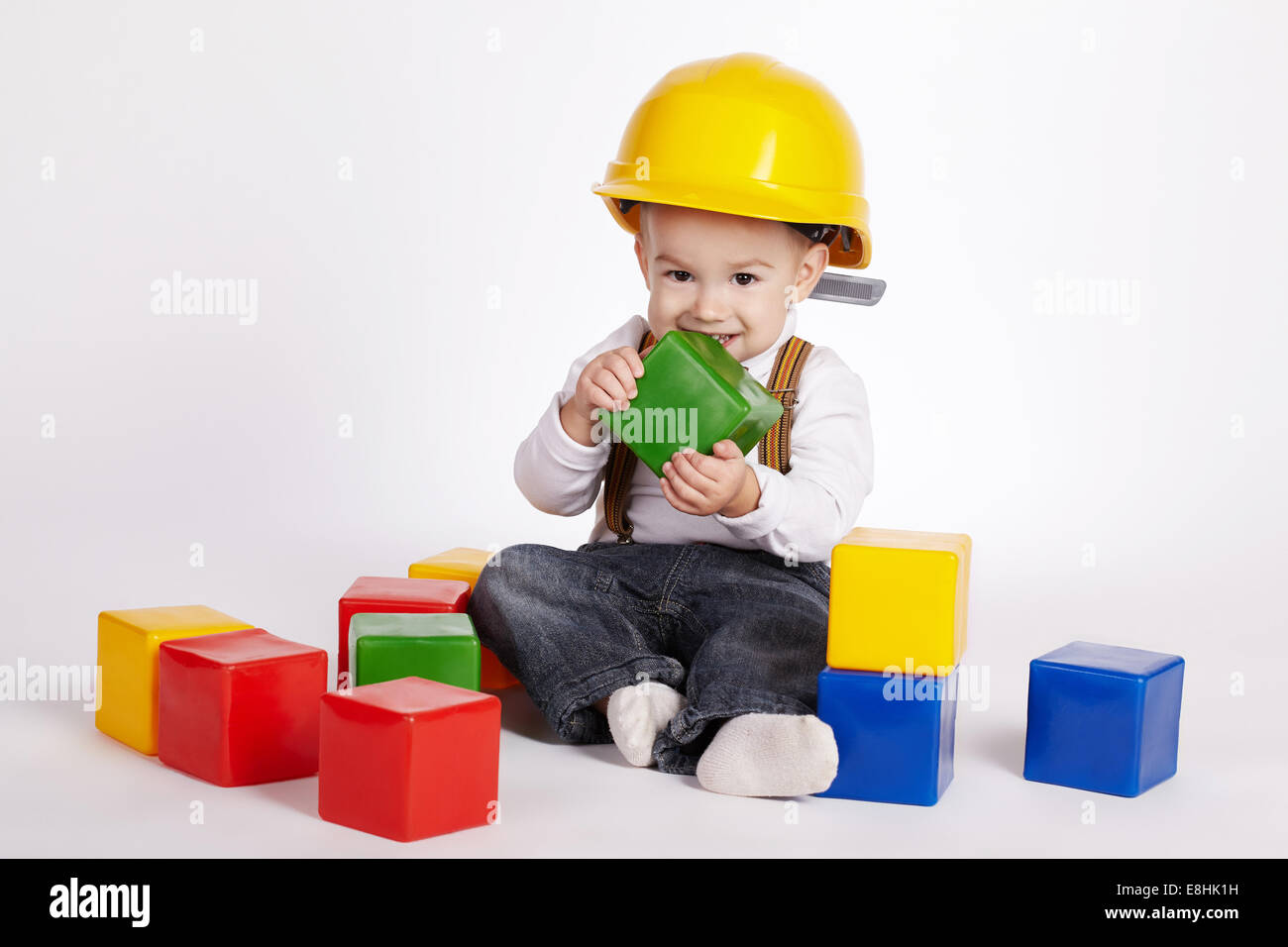 little engineer plays with cubes Stock Photo - Alamy