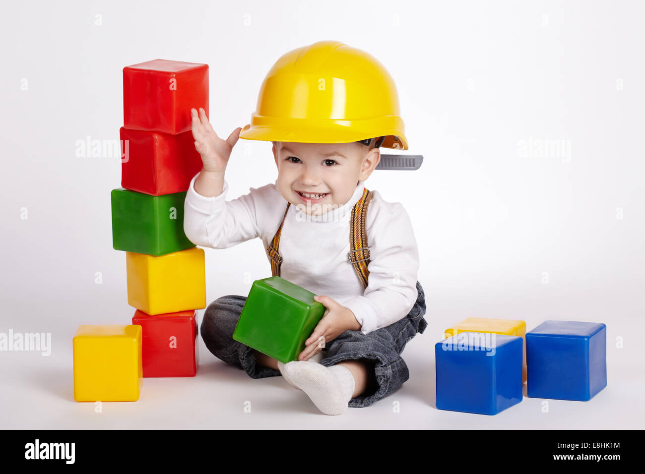 little engineer plays with cubes Stock Photo - Alamy