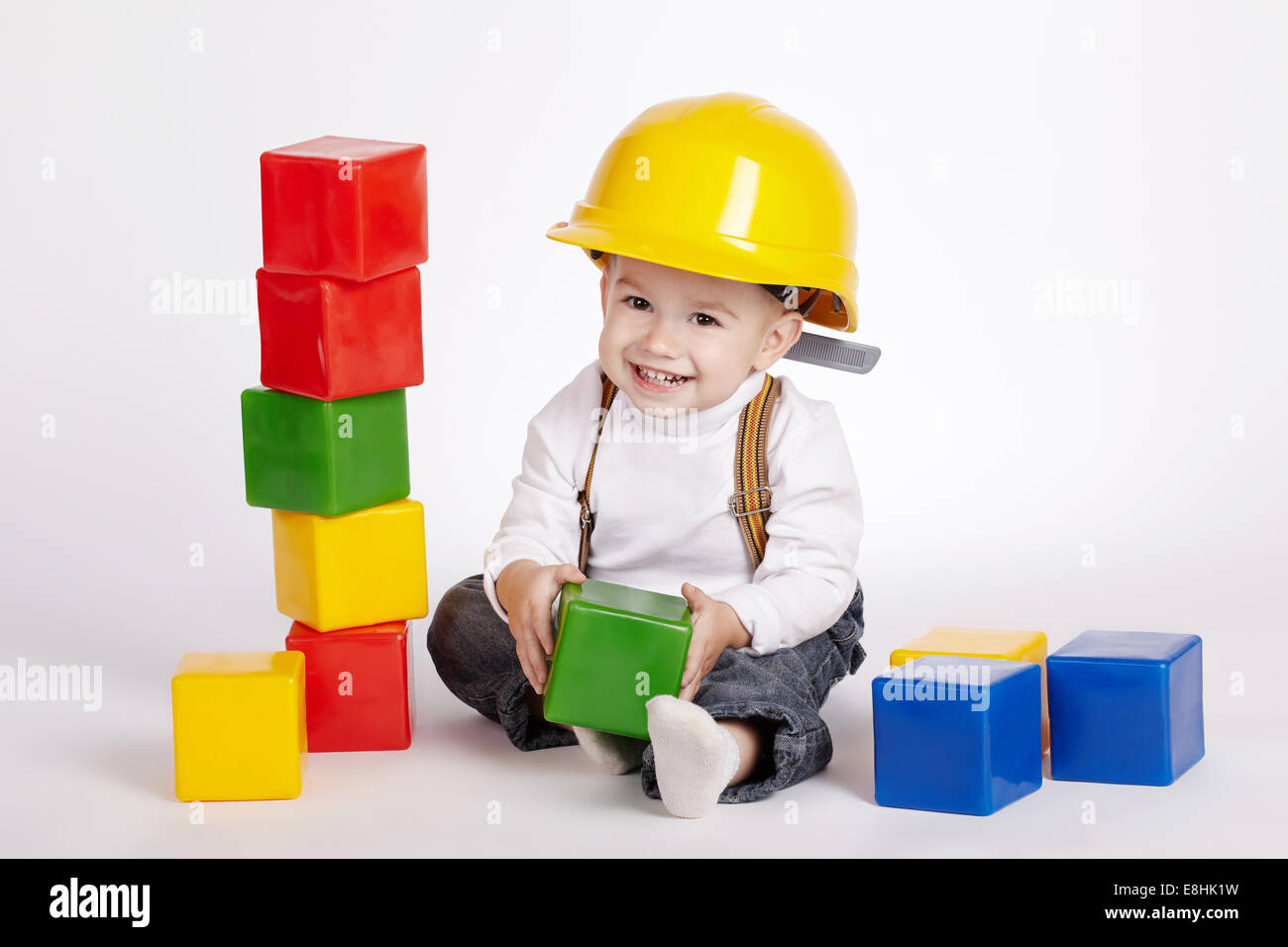little engineer plays with cubes Stock Photo - Alamy