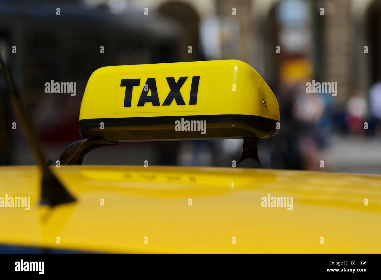 Bright Yellow Taxi sign on top pf a vehicle on the street of Prague ...