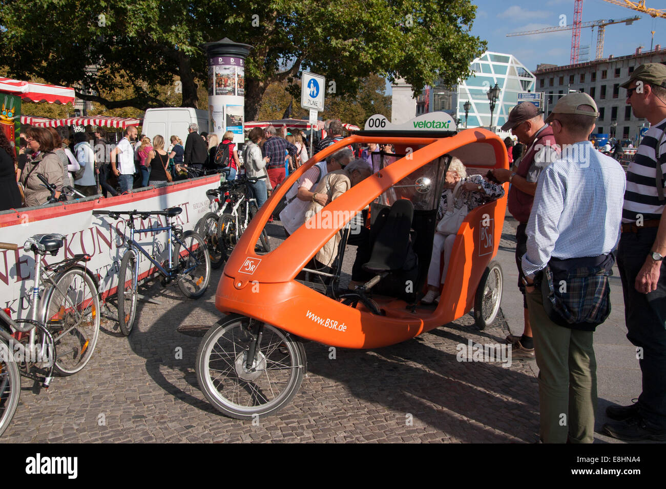 Street Velotaxi cycle rickshaw People Berlin Germany Stock Photo - Alamy